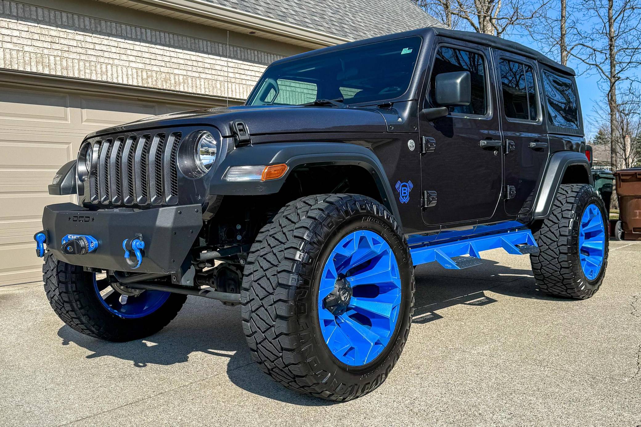 Black jeep wrangler with blue accents store